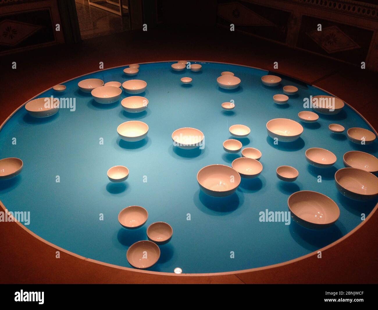 Dishes floating in a tub of water Stock Photo - Alamy