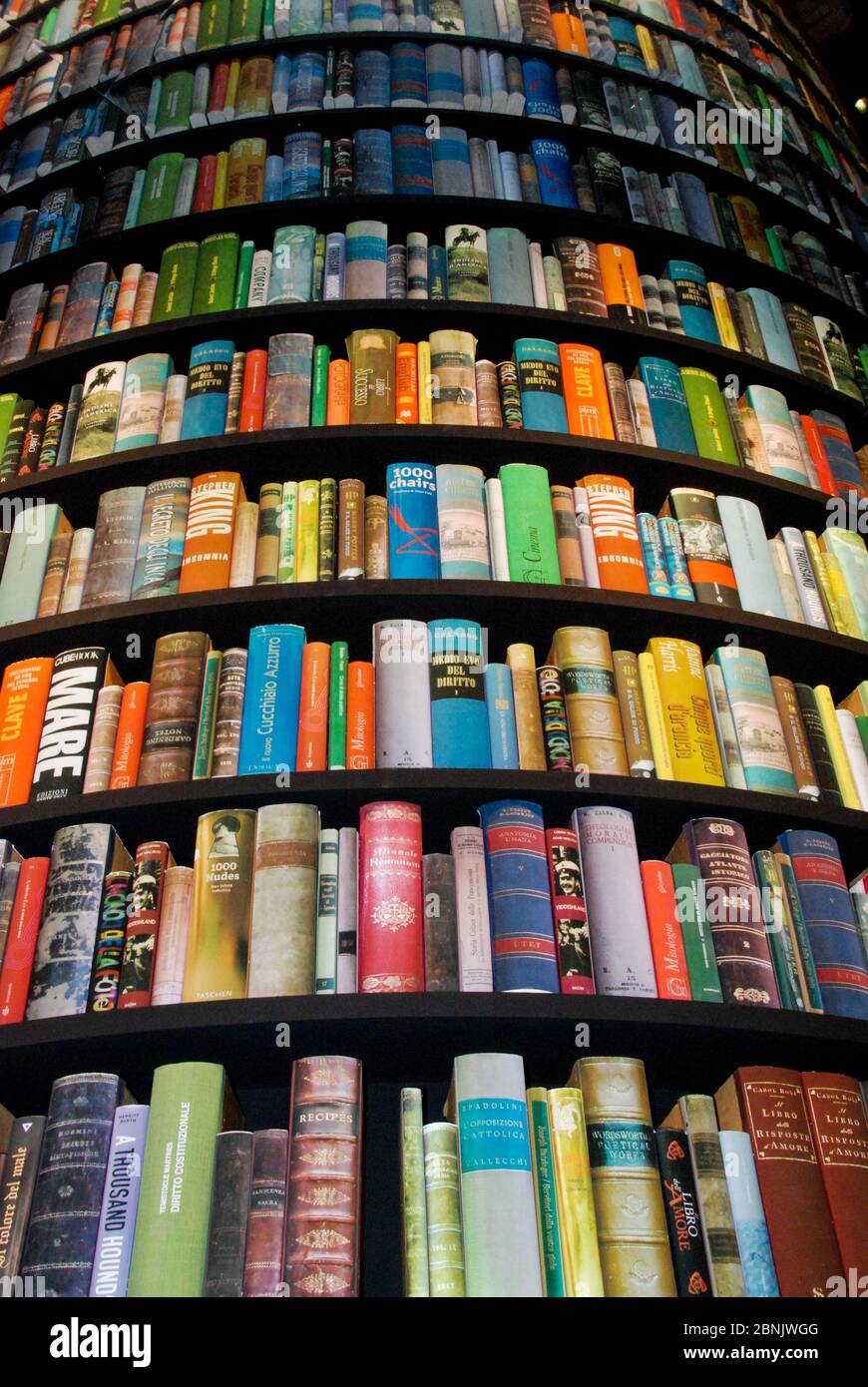 Books in a tower-shaped bookcase Stock Photo - Alamy