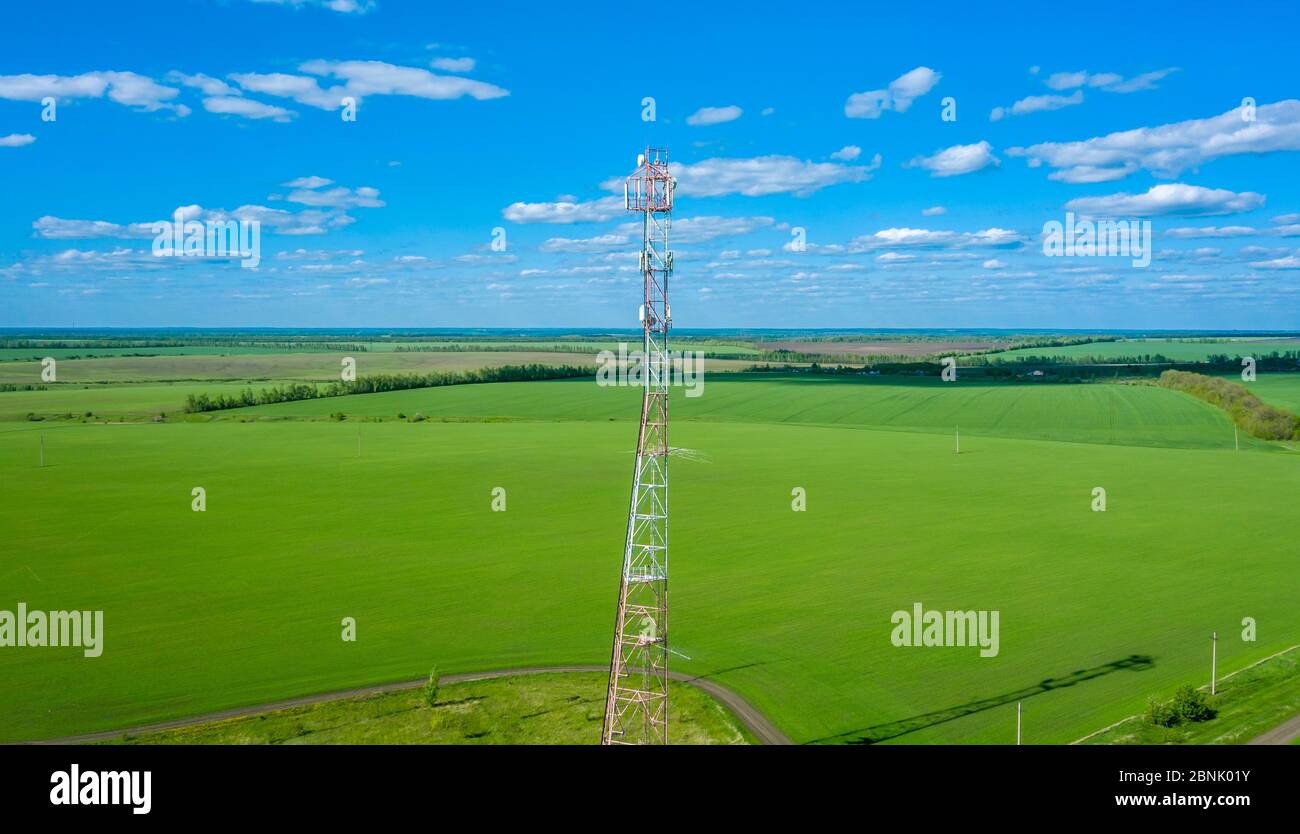 aerial photo of a mobile phone tower on the background of a beautiful ...