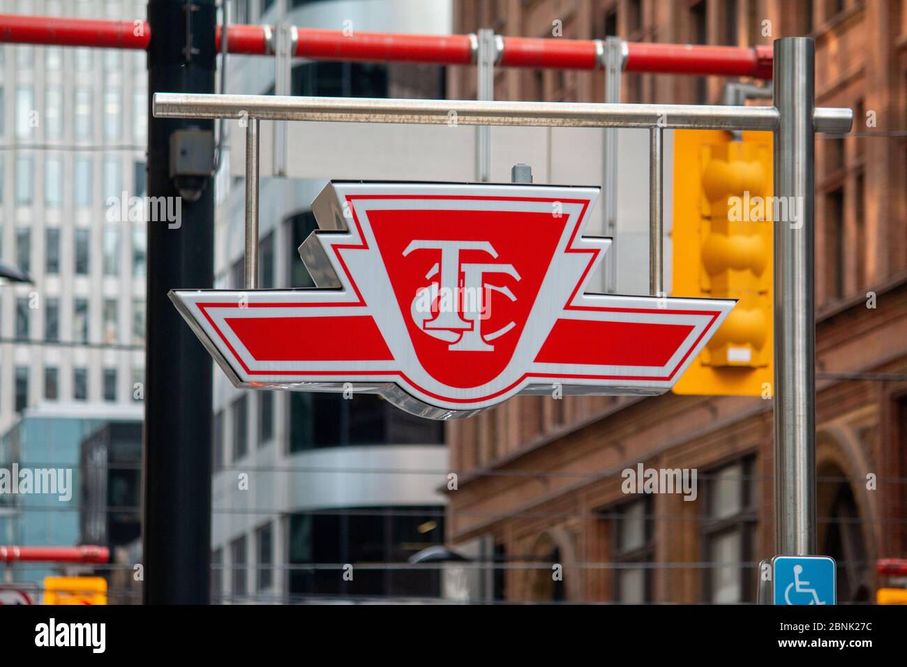 TTC (Toronto Transit Comission) signs hanging over a subway entrance ...