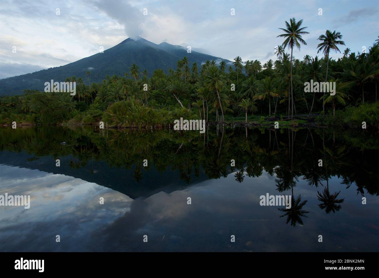 Mount Gamalama volcano. Active volcano on Ternate Island reflecting in ...
