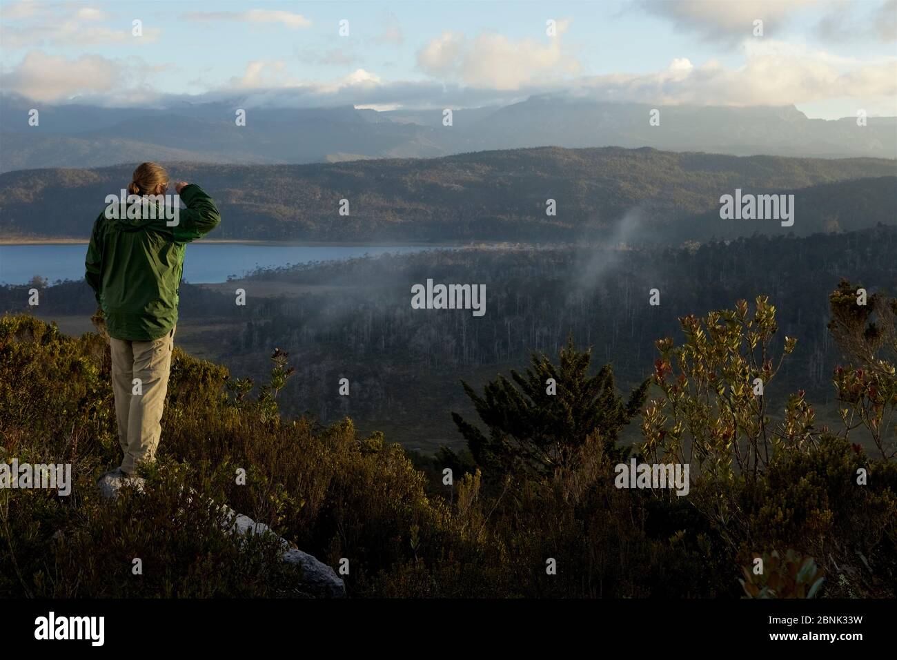 Edwin Scholes looking at Lake Habbema with 4750 m high Peak Trikora (Mt ...