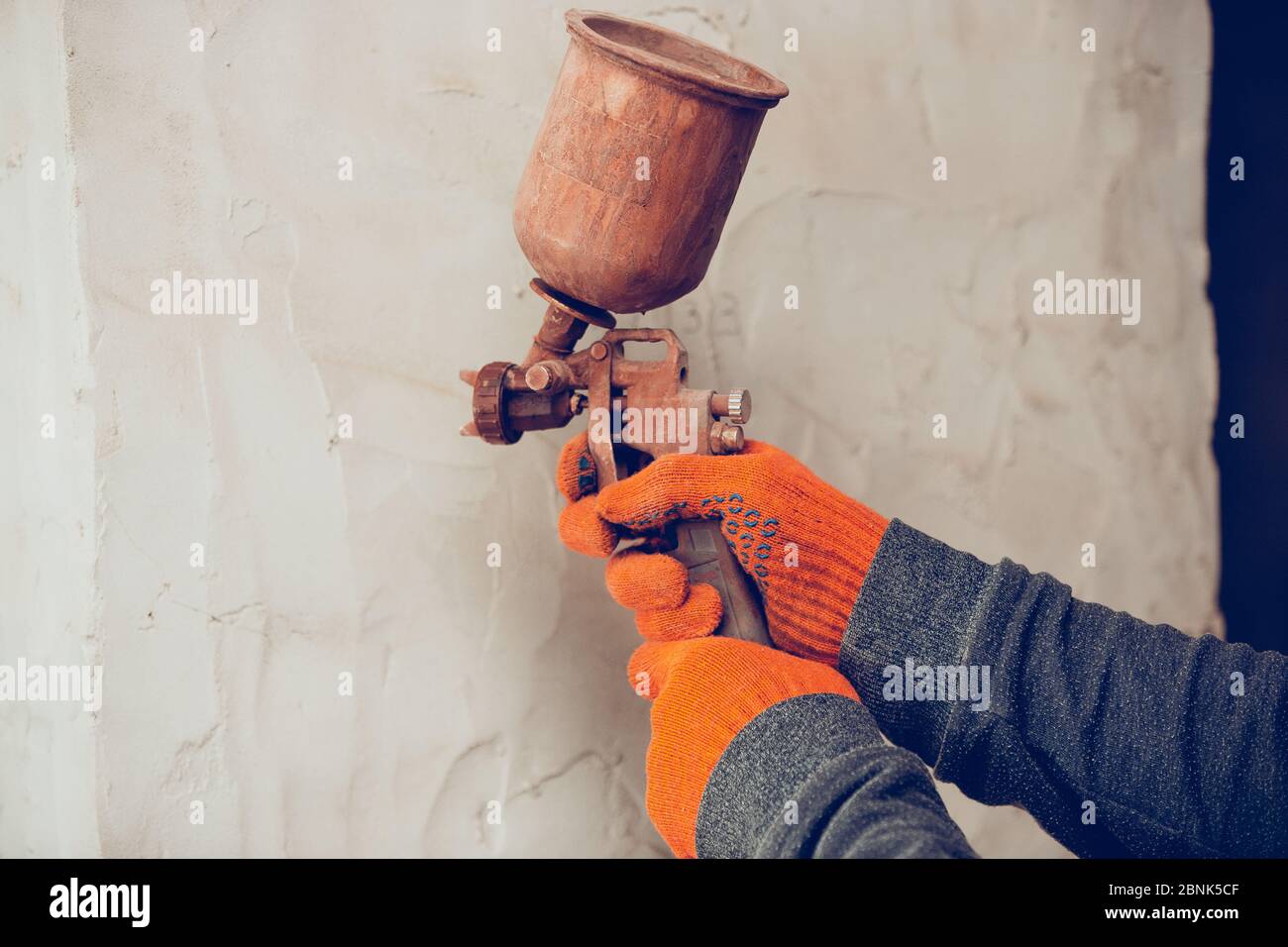 Closeup of repairman in uniform, professional builder working using ...