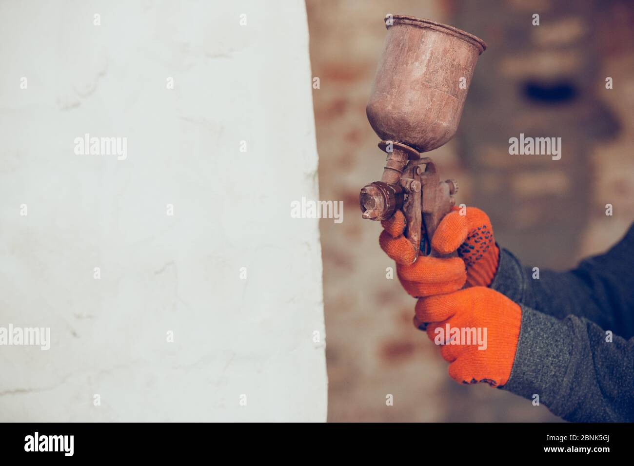 Closeup of repairman in uniform, professional builder working using ...