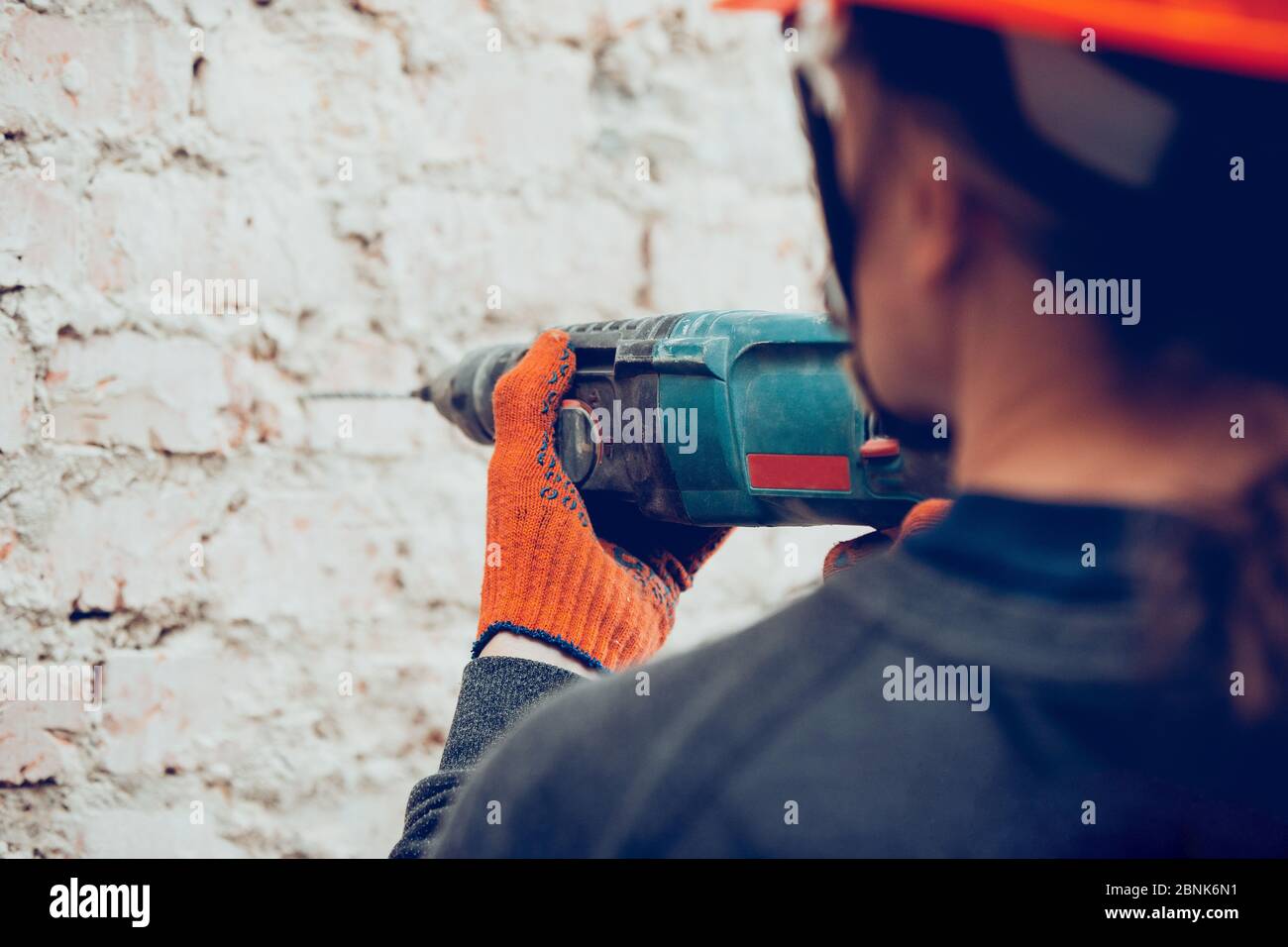 Closeup of repairman in uniform, professional builder working using ...