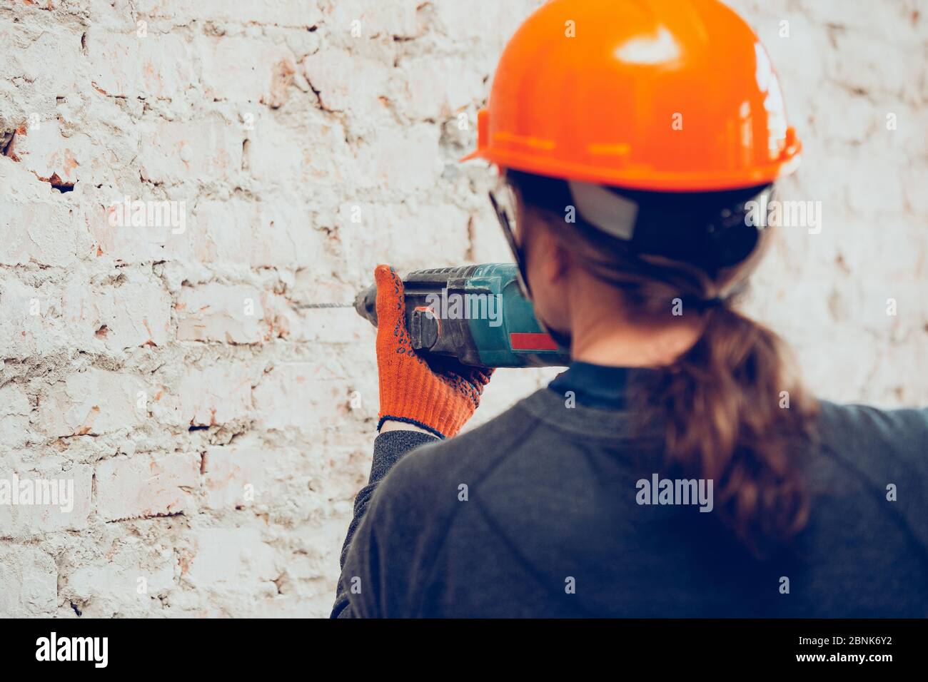 Closeup of repairman in uniform, professional builder working using ...