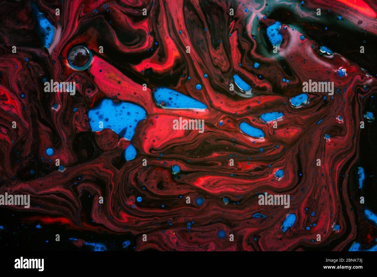 Abstract background with waves and streaks of blue, black and red ...