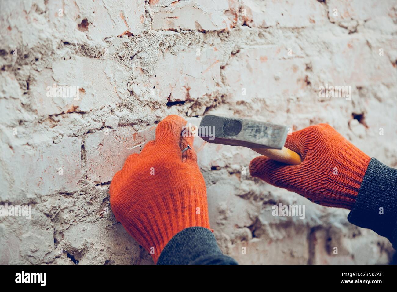 Closeup of repairman in uniform, professional builder working using ...