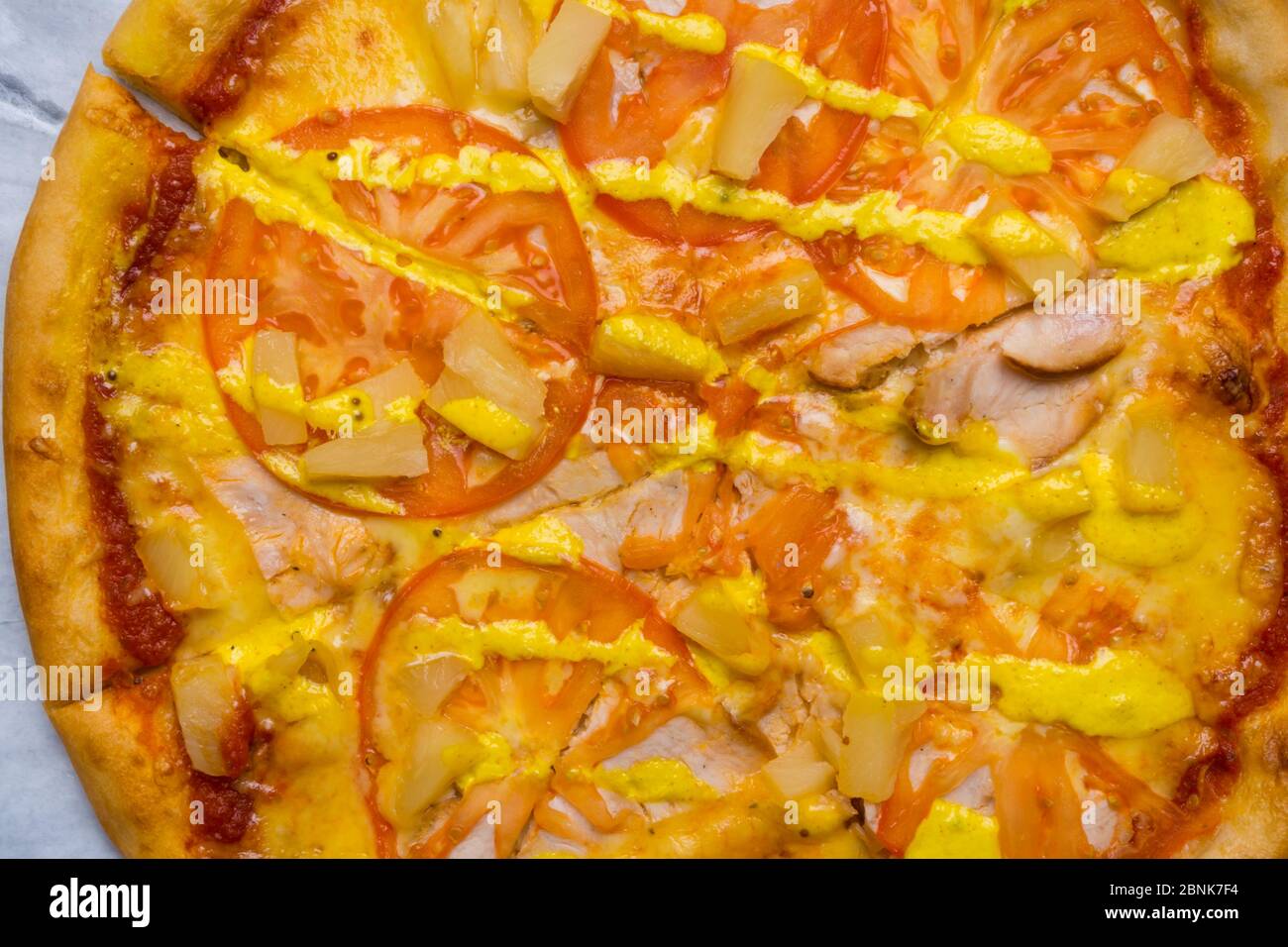 Delicious italian pizza with chicken, toomato and sauces Stock Photo ...