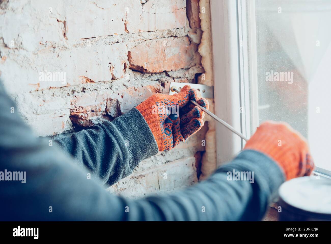 Closeup of repairman in uniform, professional builder working using ...