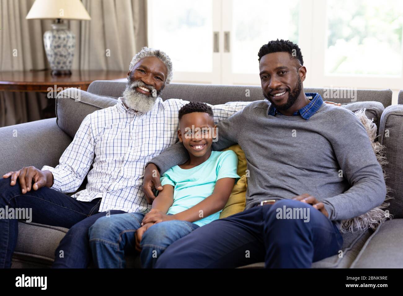 Multi-generation mixed-race family enjoying their time at home Stock ...
