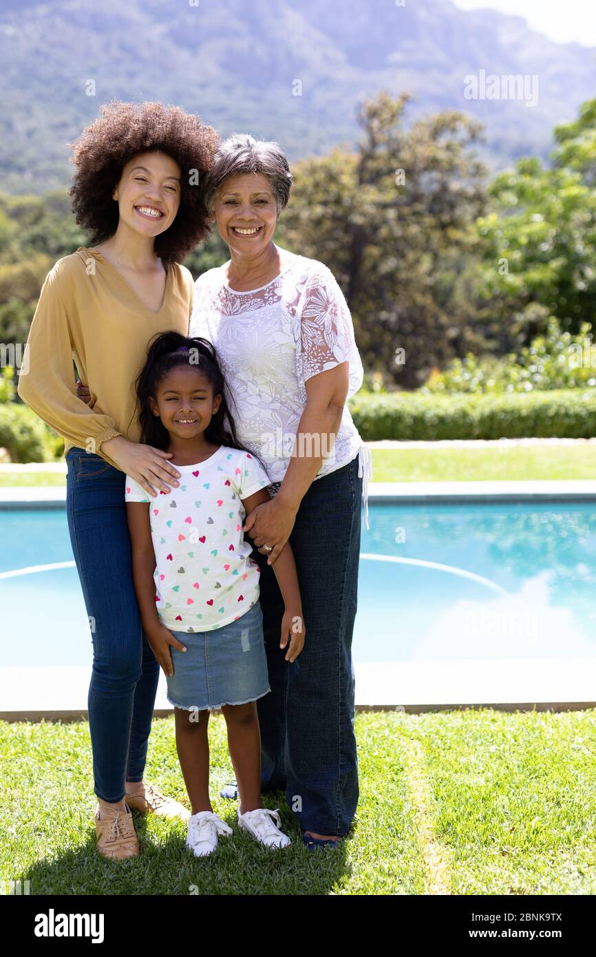 Multi-generation mixed race family enjoying their time at a garden ...
