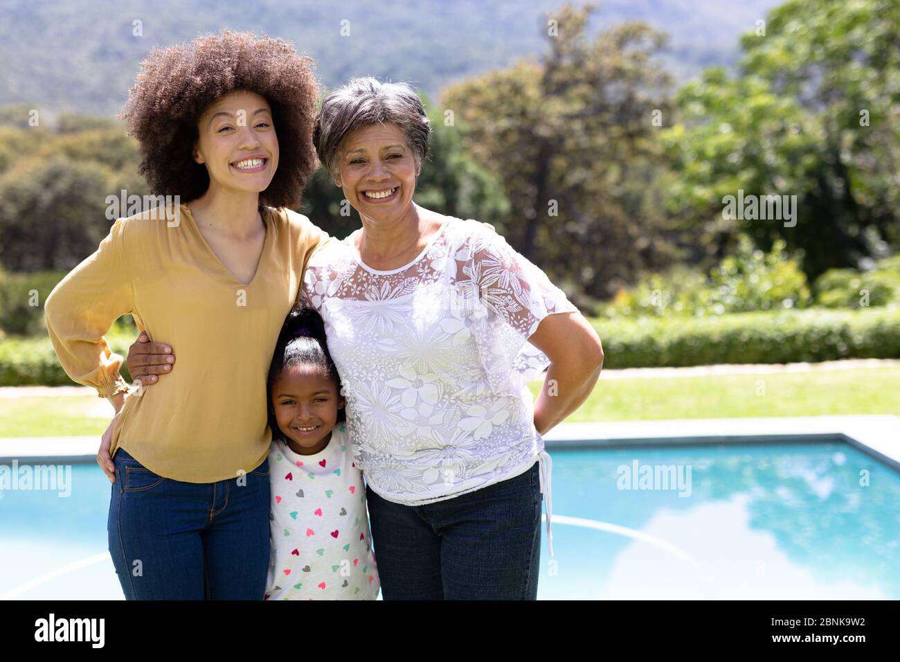 Multi-generation mixed race family enjoying their time at a garden ...