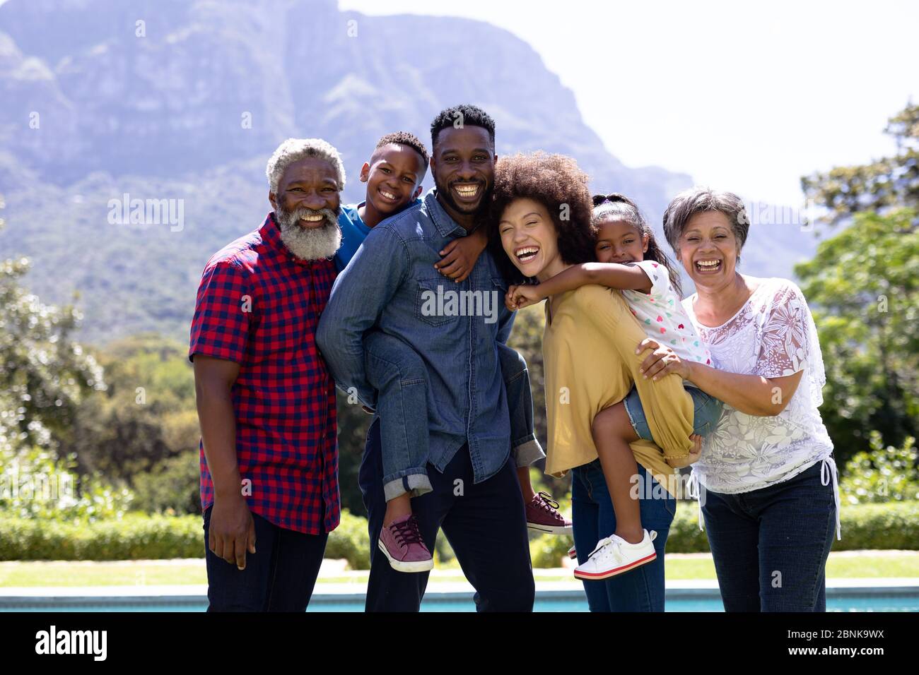 Multi-generation mixed race family enjoying their time at a garden ...