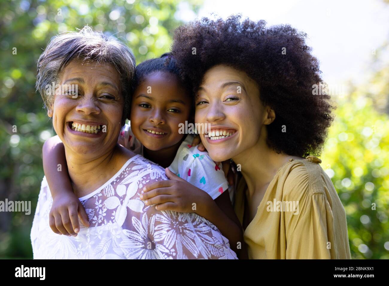 Multi-generation mixed race family enjoying their time at a garden ...