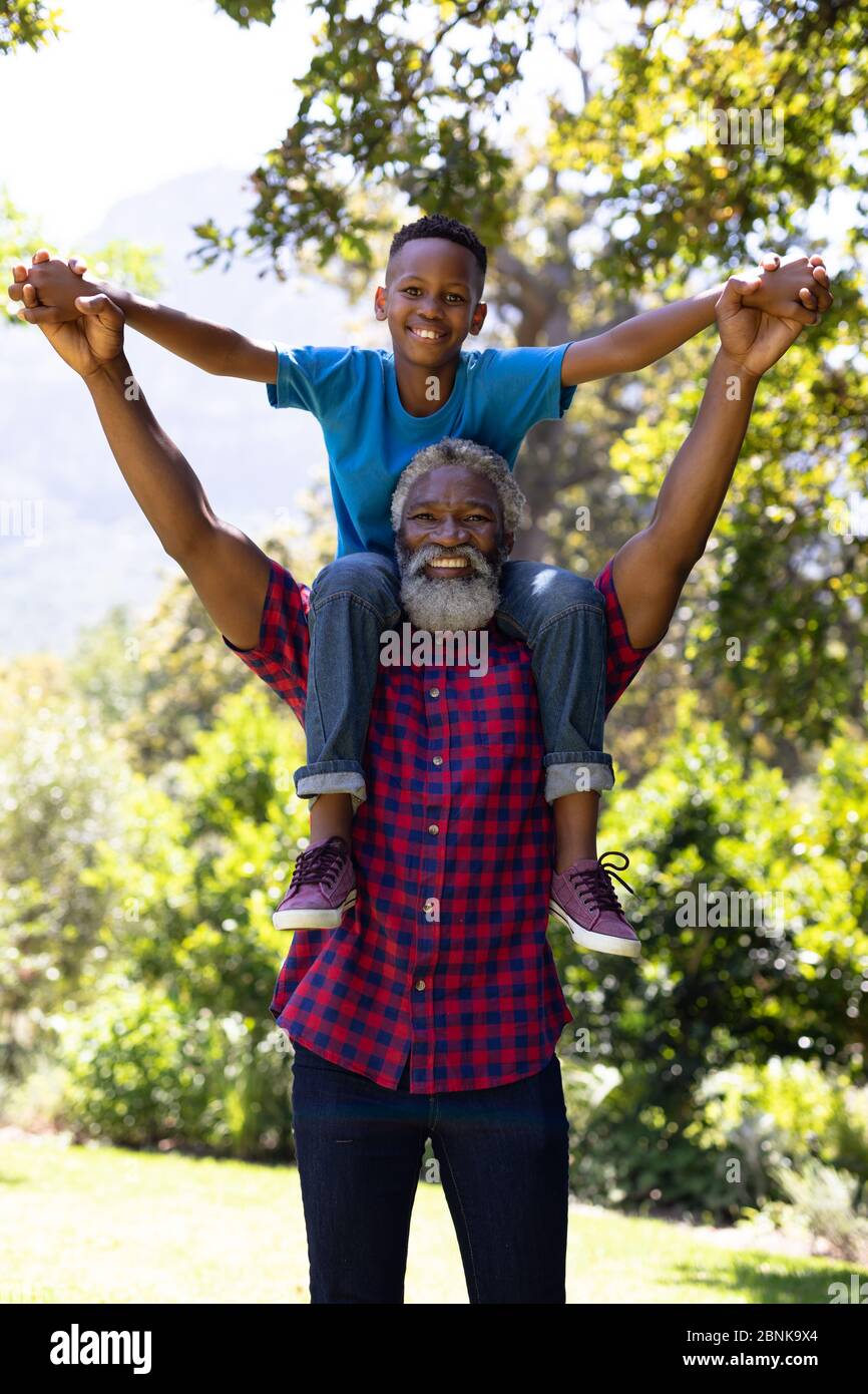 Multi-generation mixed race family enjoying their time at a garden ...