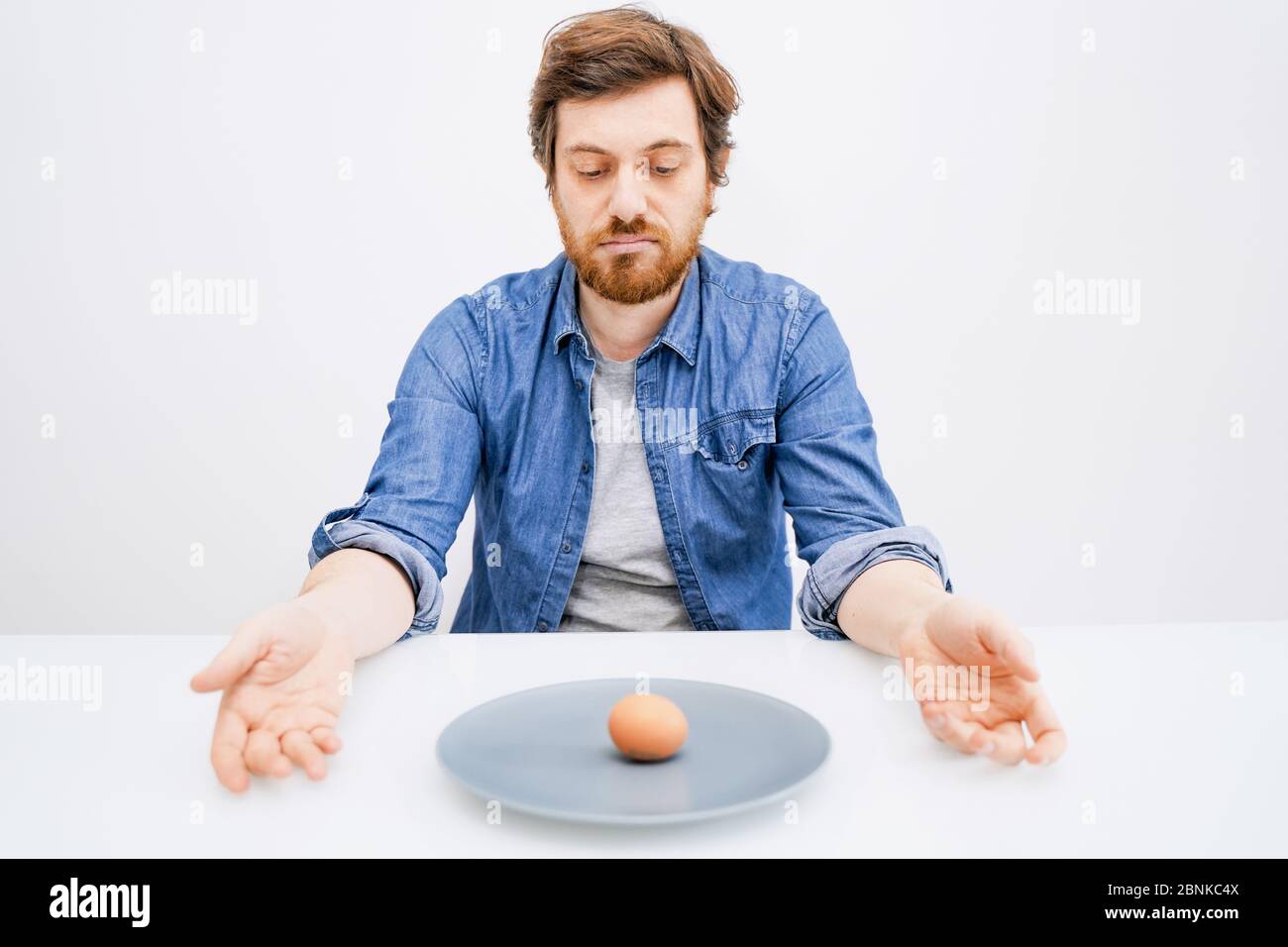 Very hungry white man hi-res stock photography and images - Alamy
