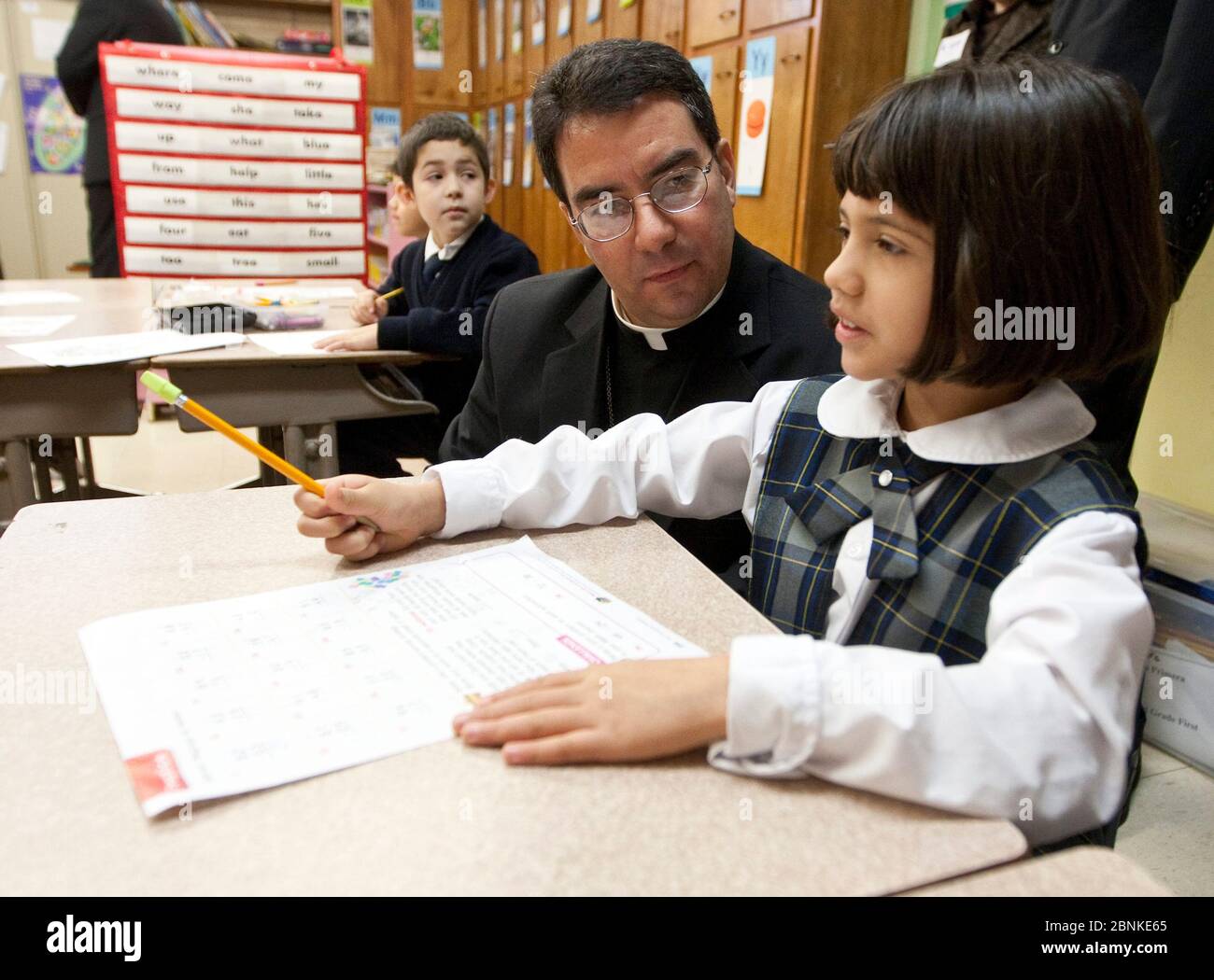 Catholic bishop wearing the traditional clerical collar speaks with ...
