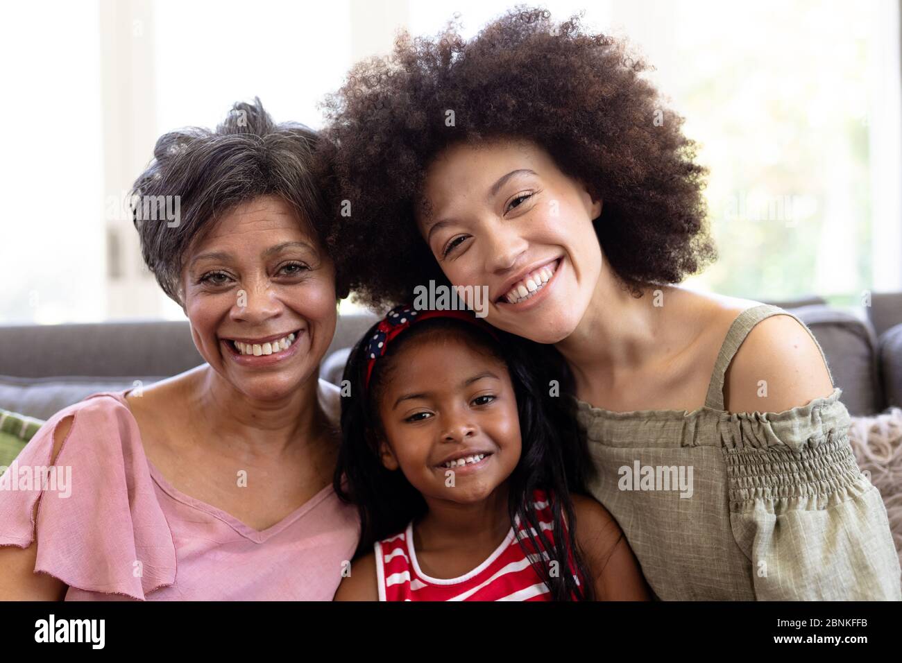 Multi-generation mixed-race family enjoying their time at home Stock ...