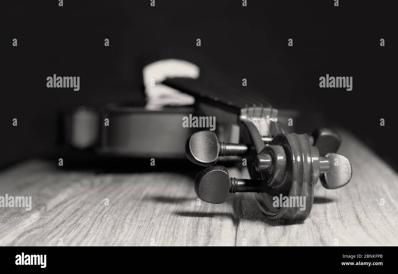 Musical instrument fiddle in a wood table black and white Stock Photo ...