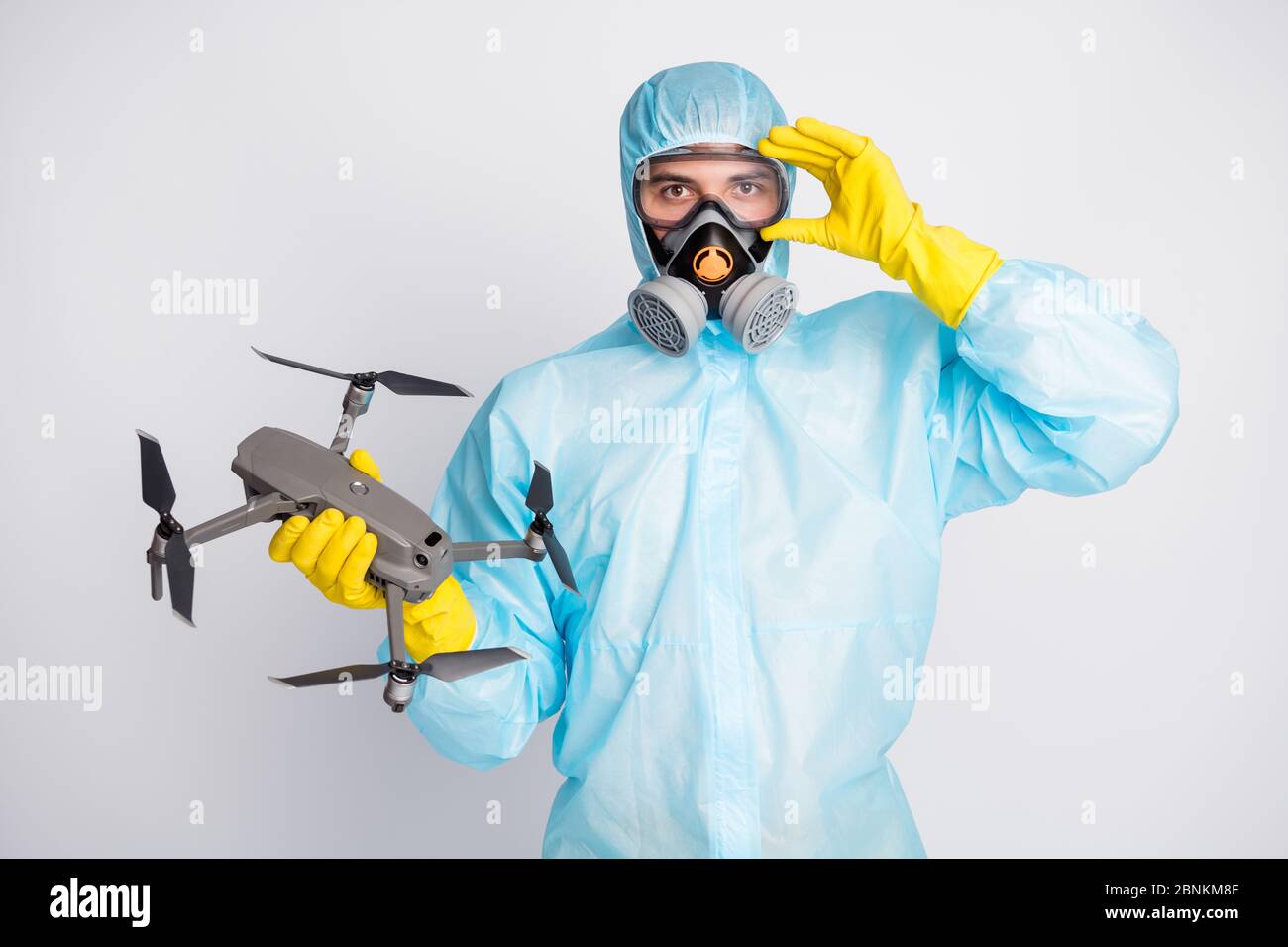 Portrait of man hold airplane robot drone need video surface wear white ...