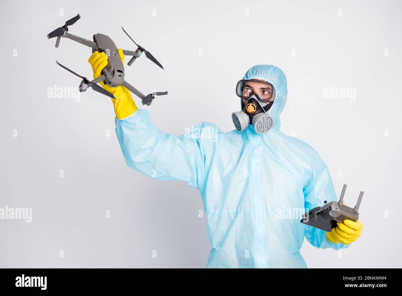 Portrait man hold joystick robot airplane drone imagine air fly video ...