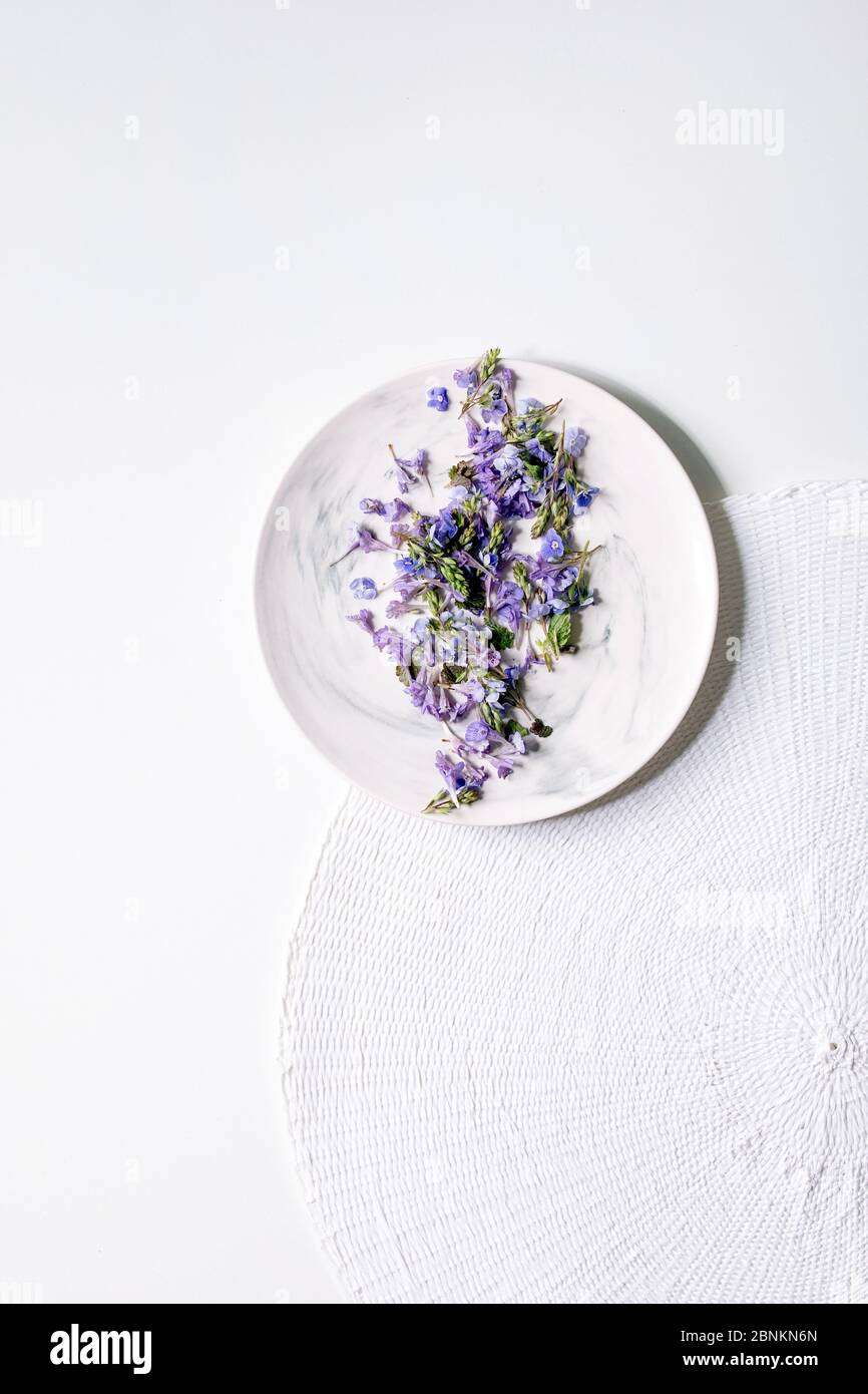 Edible flowers on plate Stock Photo - Alamy