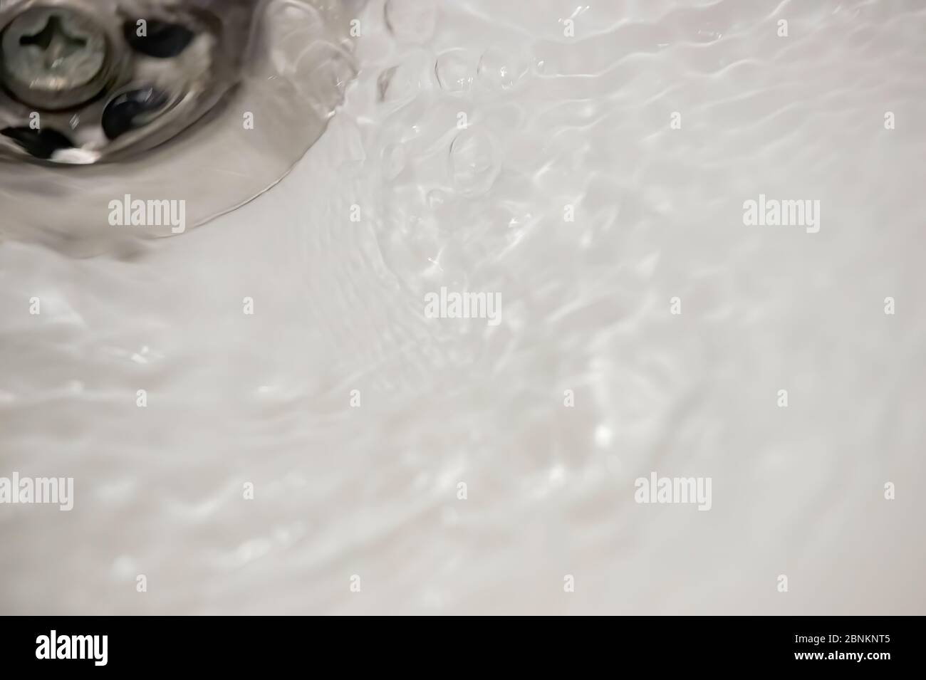 water flow into drain in bath Stock Photo - Alamy