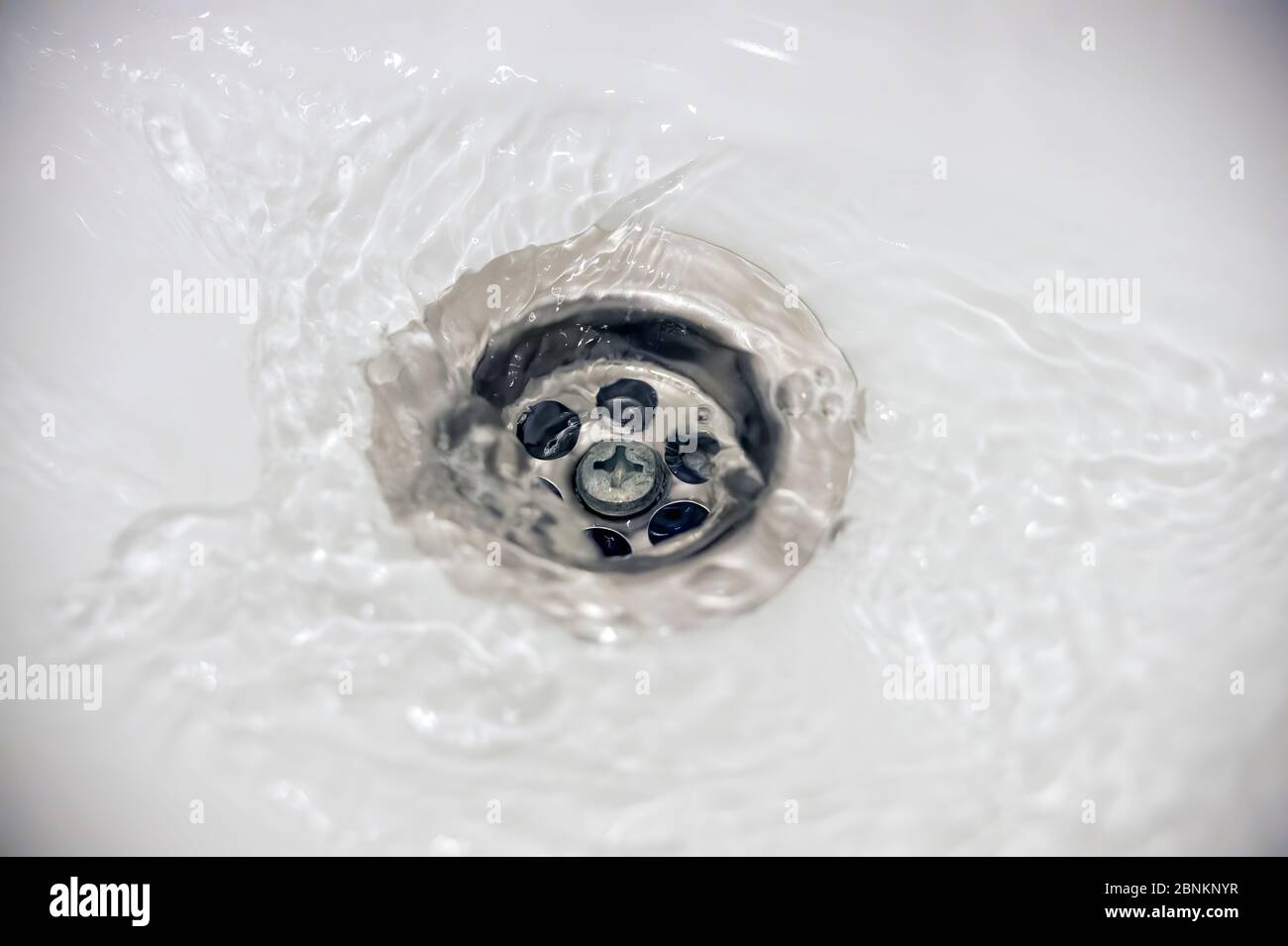 water flow into drain in bath Stock Photo - Alamy