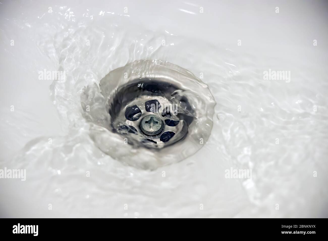 water flow into drain in bath Stock Photo - Alamy