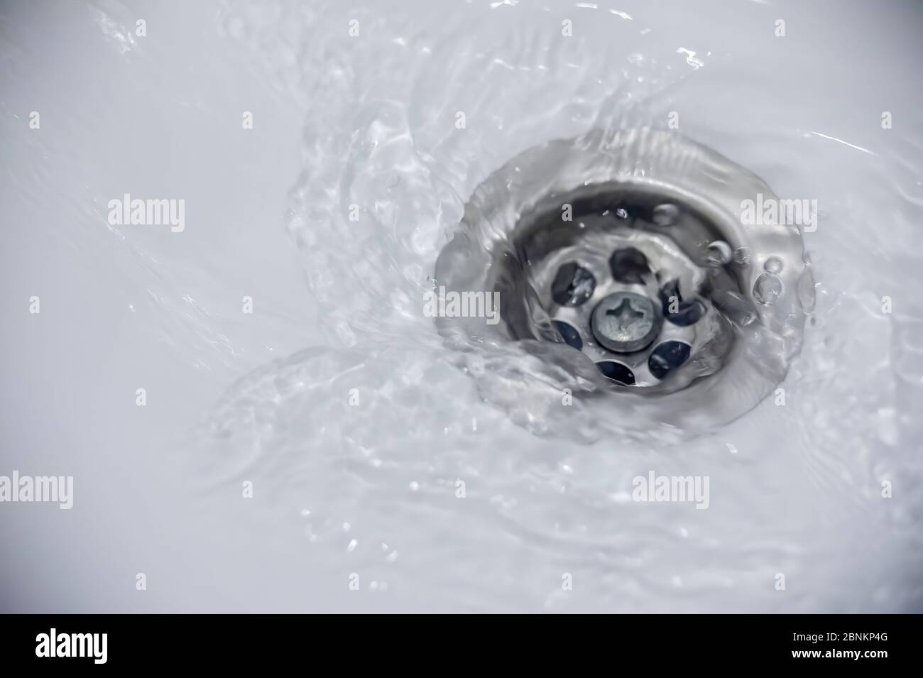 water flow into drain in bath Stock Photo - Alamy