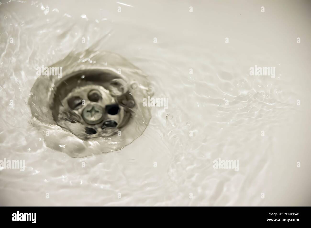 water flow into drain in bath Stock Photo - Alamy