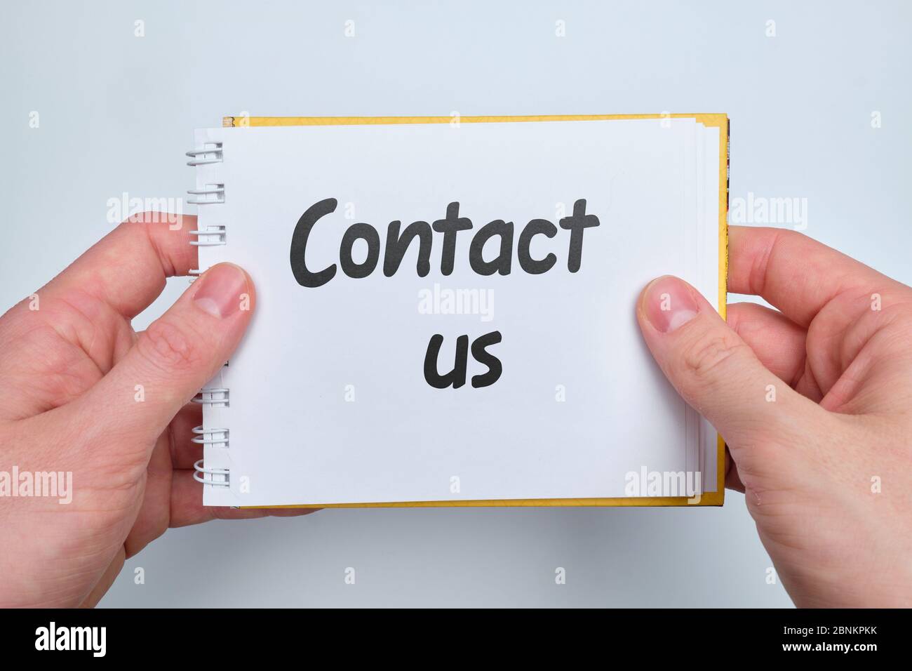 Lettering on paper contact us as a feedback concept. Close up Stock ...