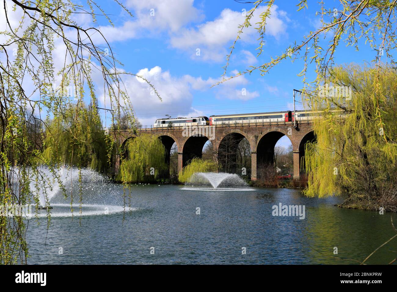 Greater Anglia train passing over the viaduct in Central Park ...