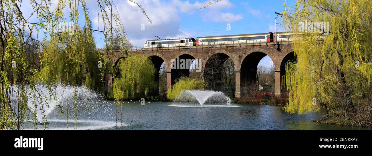 Greater Anglia train passing over the viaduct in Central Park ...