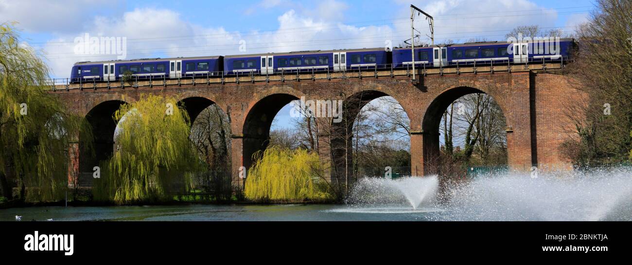Greater Anglia train passing over the viaduct in Central Park ...