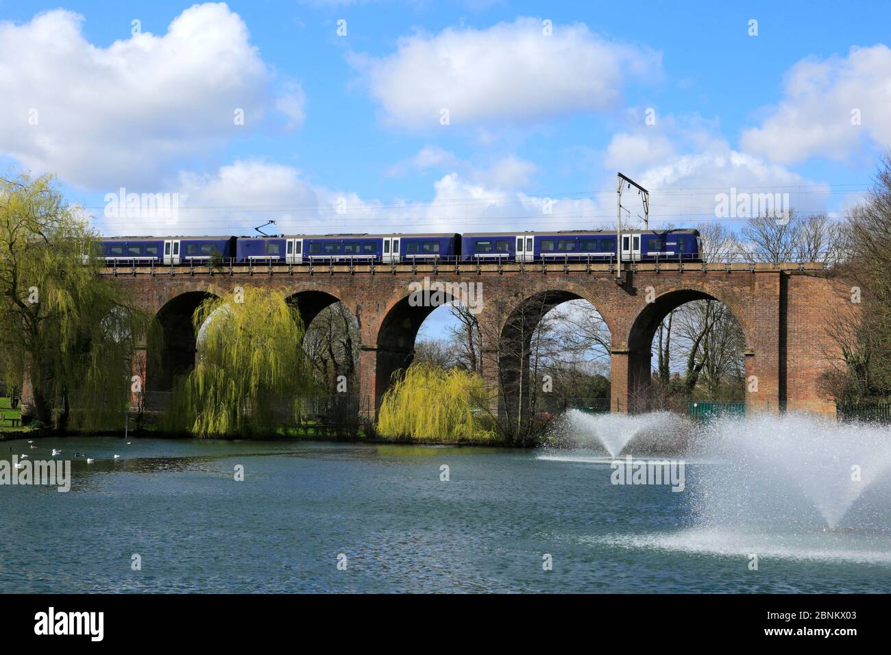 Greater Anglia train passing over the viaduct in Central Park ...