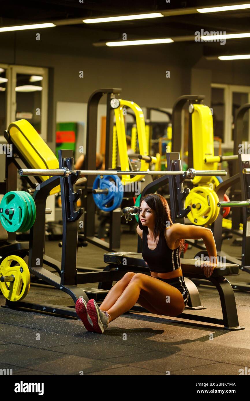 Girl performs exercises in the gym Stock Photo - Alamy