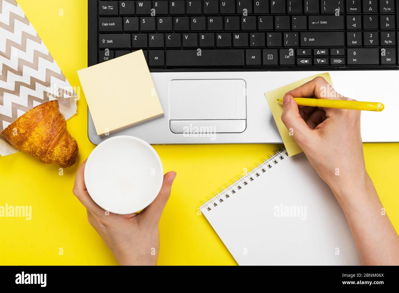 Working morning. Girl works for laptop. Breakfast at work - cappuccino ...
