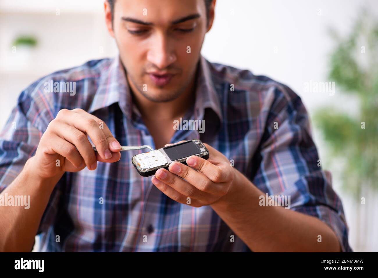 Technician checking phone circuit hi-res stock photography and images ...
