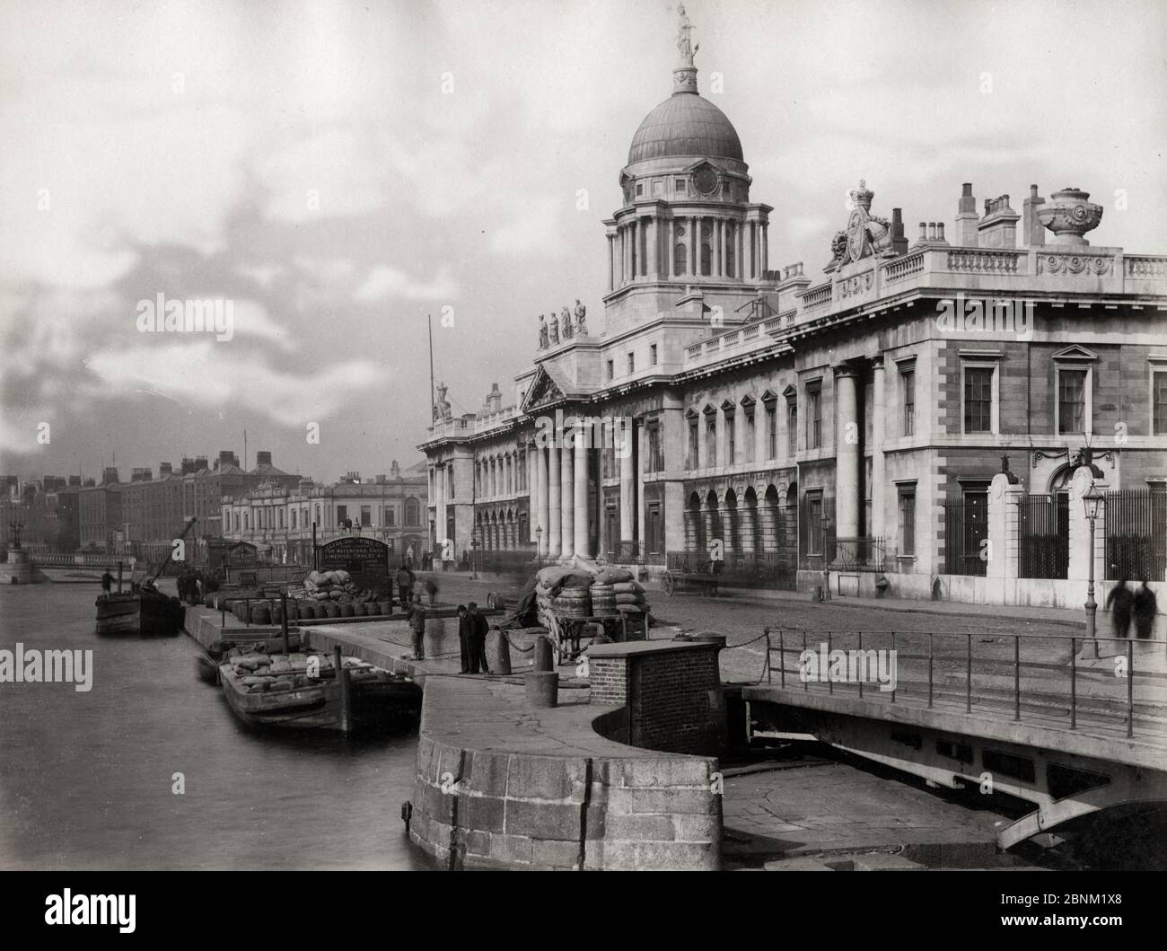 Barges for freight tied up outside the Customs House on the River ...