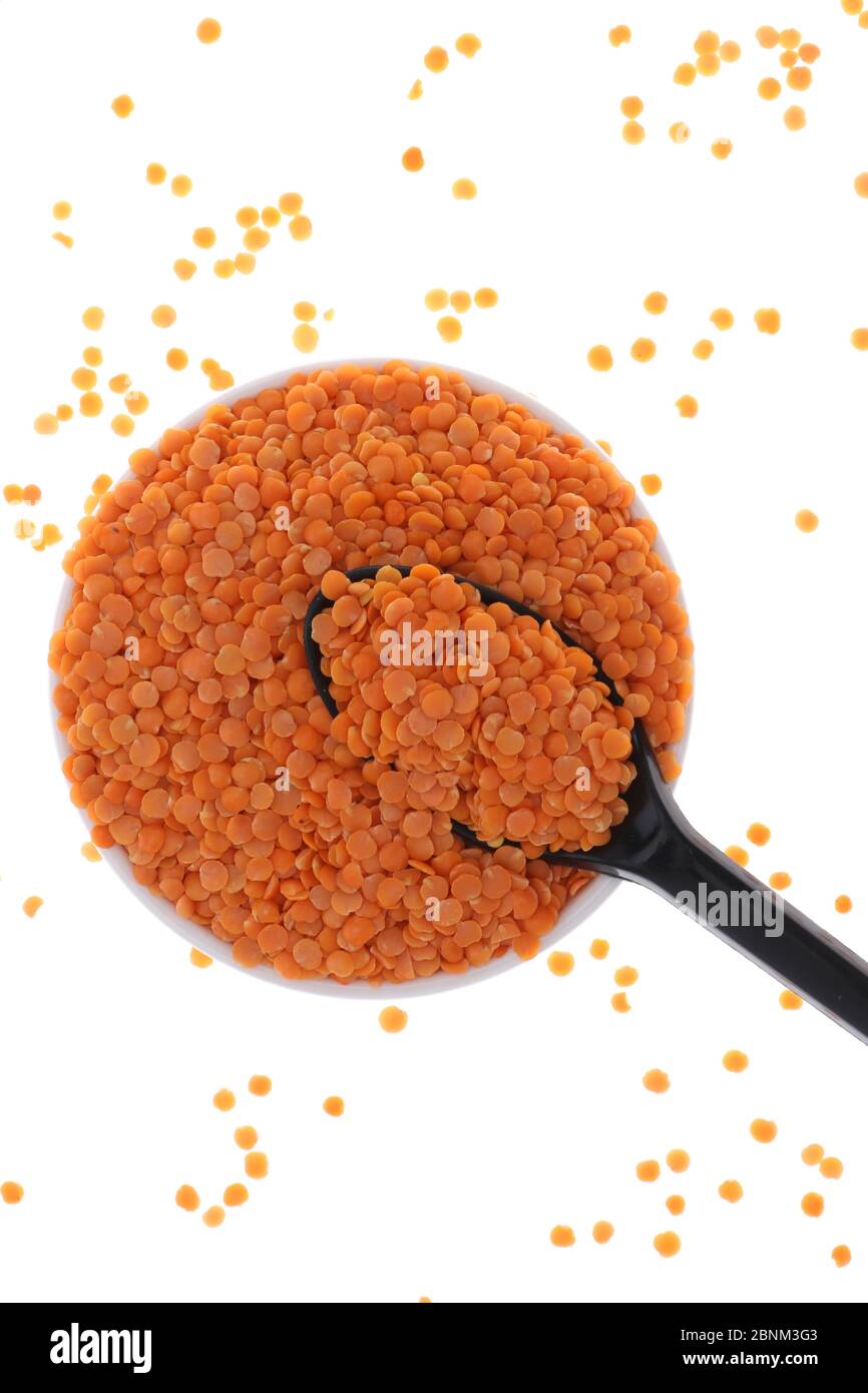 Close up of Orange Masoor Dal (Red Chief) lentil lens isolated on white ...