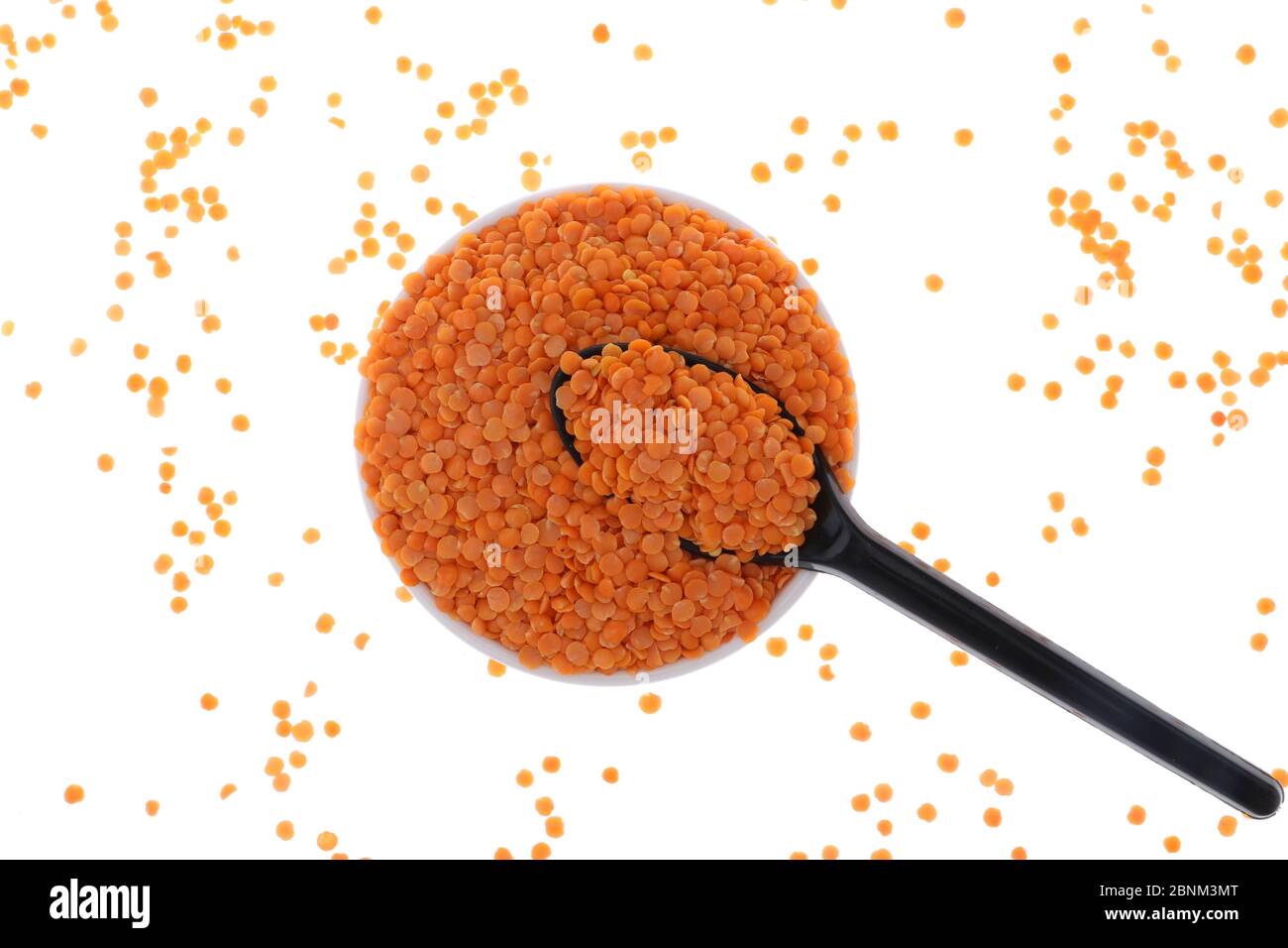 Close up of Orange Masoor Dal (Red Chief) lentil lens isolated on white ...