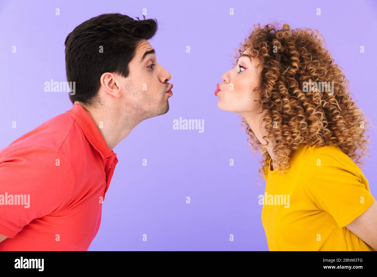 Portrait of caucasian couple man and woman kissing each other with eyes ...