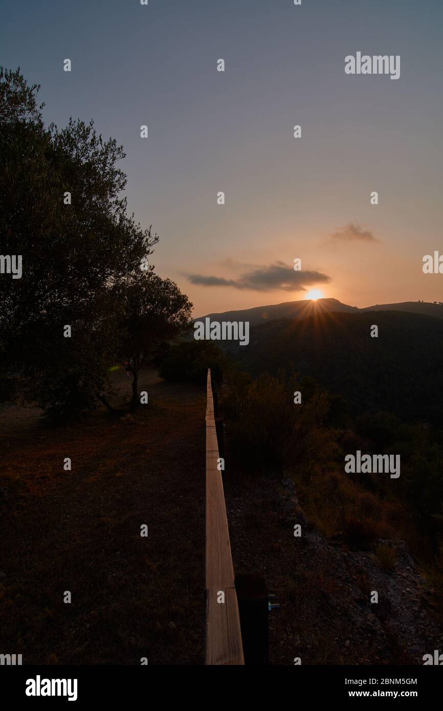 Wooden path to the sun in the mountain, Summer lights Stock Photo - Alamy