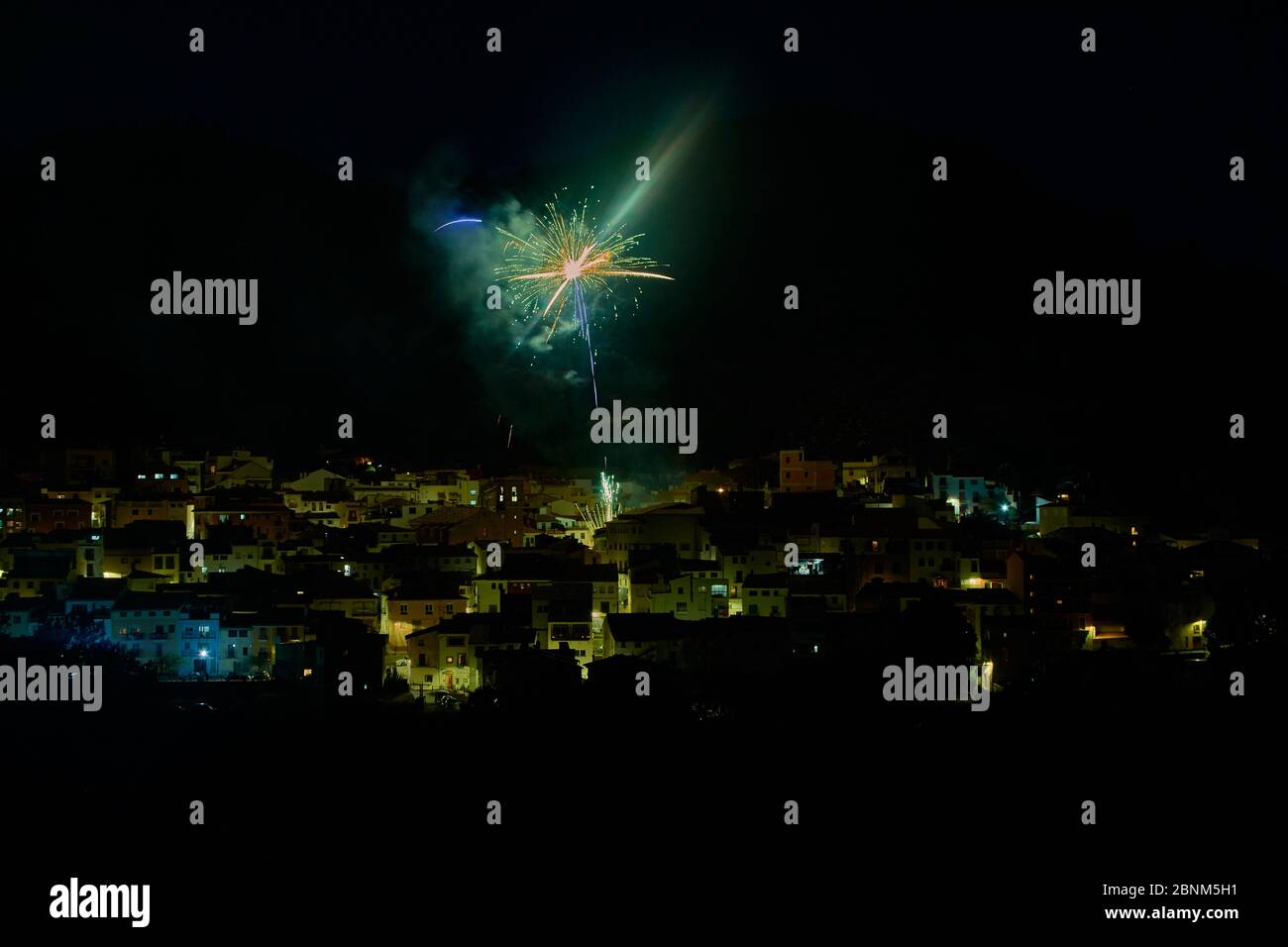 Small town in the mountains, with fireworks Stock Photo - Alamy