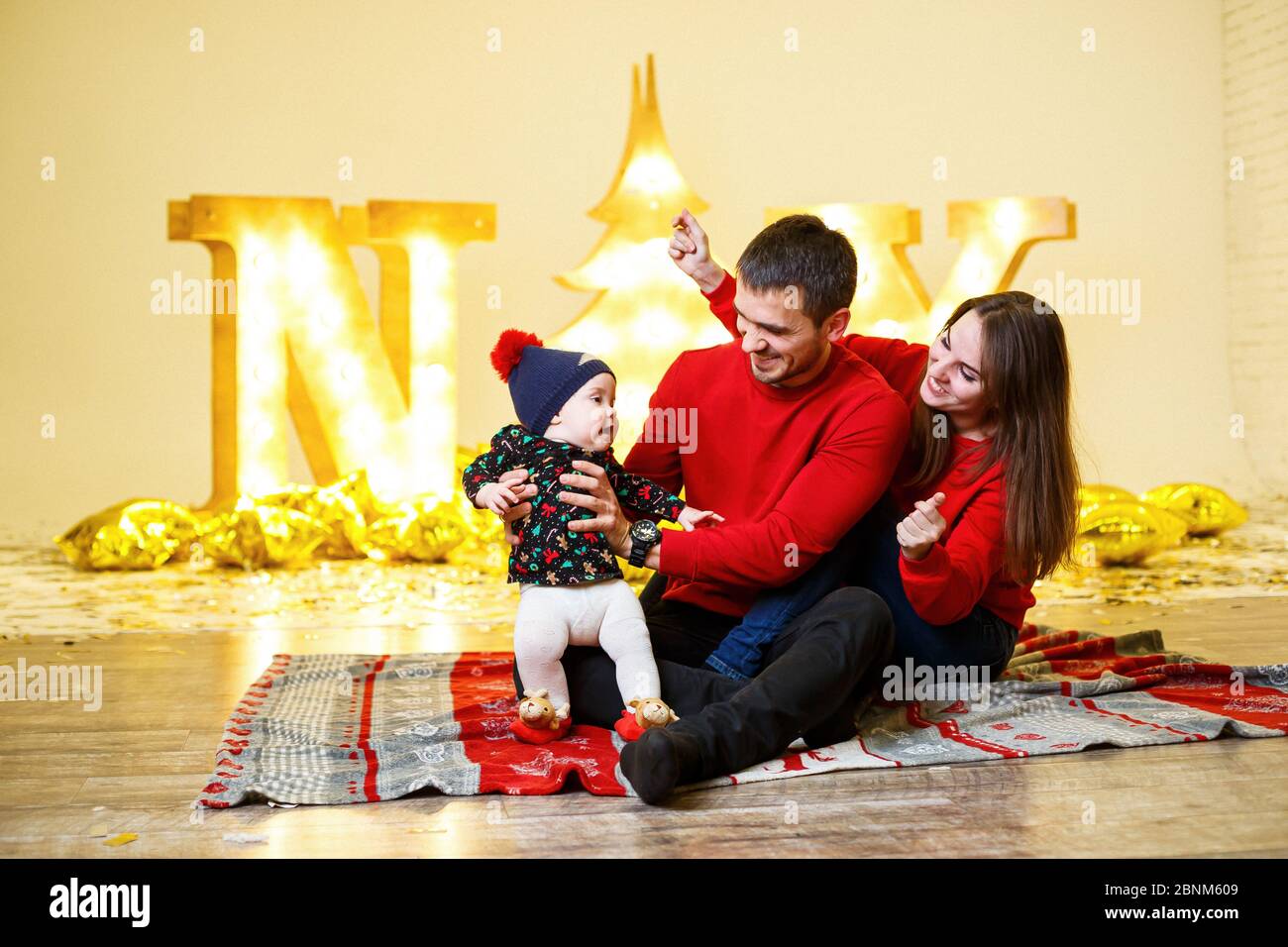 Child in red sweaters hi-res stock photography and images - Alamy