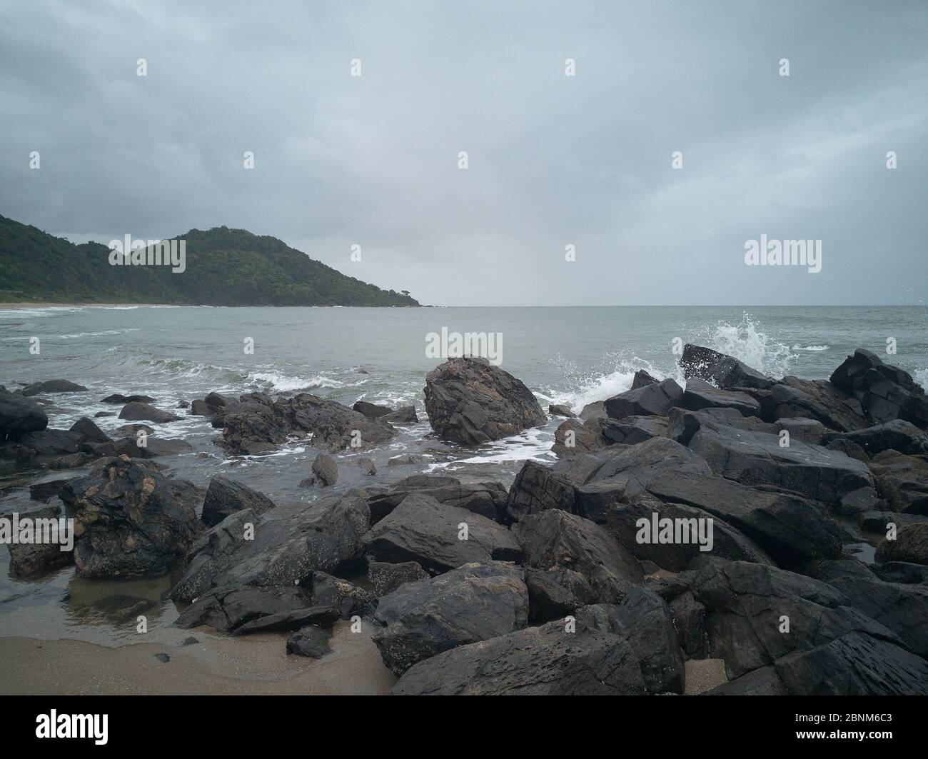 Rocks on the beach after the storm. Storm colors Stock Photo - Alamy