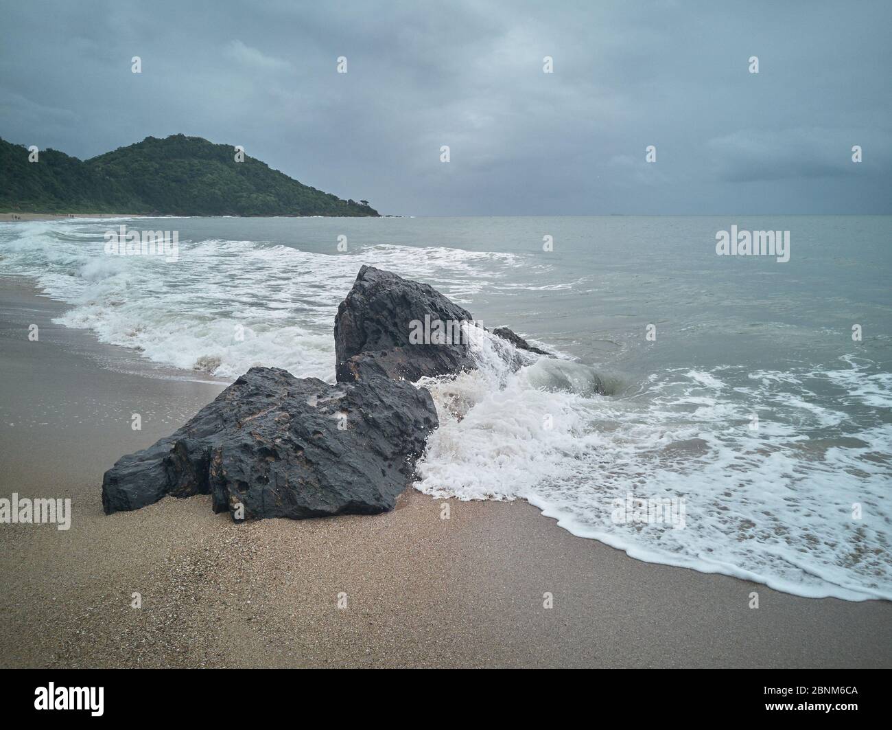 Rocks on the beach after the storm. Storm colors Stock Photo - Alamy