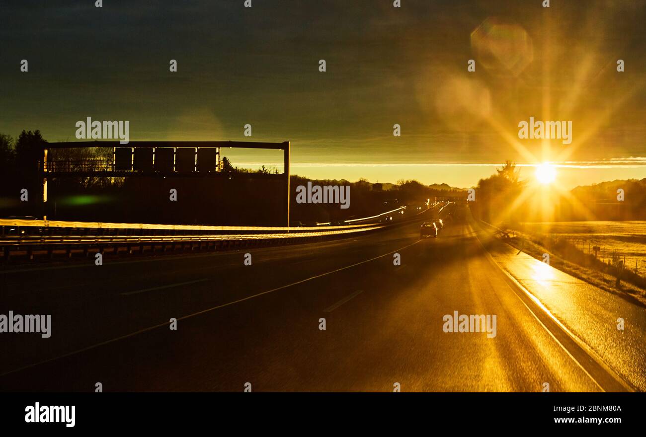 Motorway, traffic, back light, sun Stock Photo - Alamy